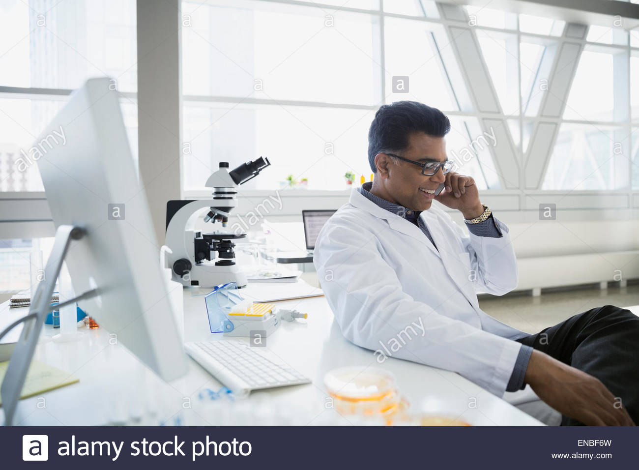 Indian man in lab coat with phone hi-res stock photography and images ...