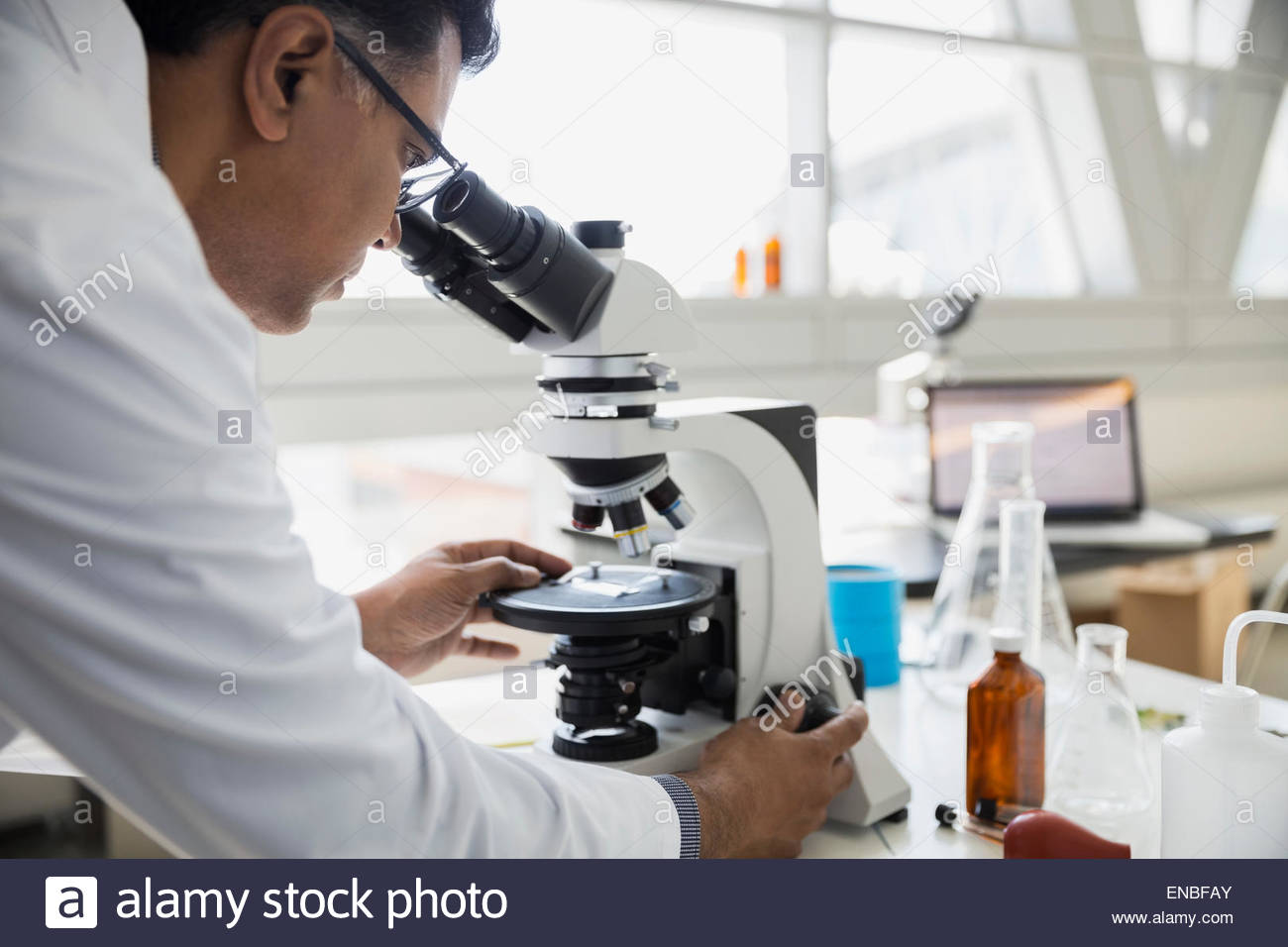 Scientist using microscope in laboratory Stock Photo - Alamy