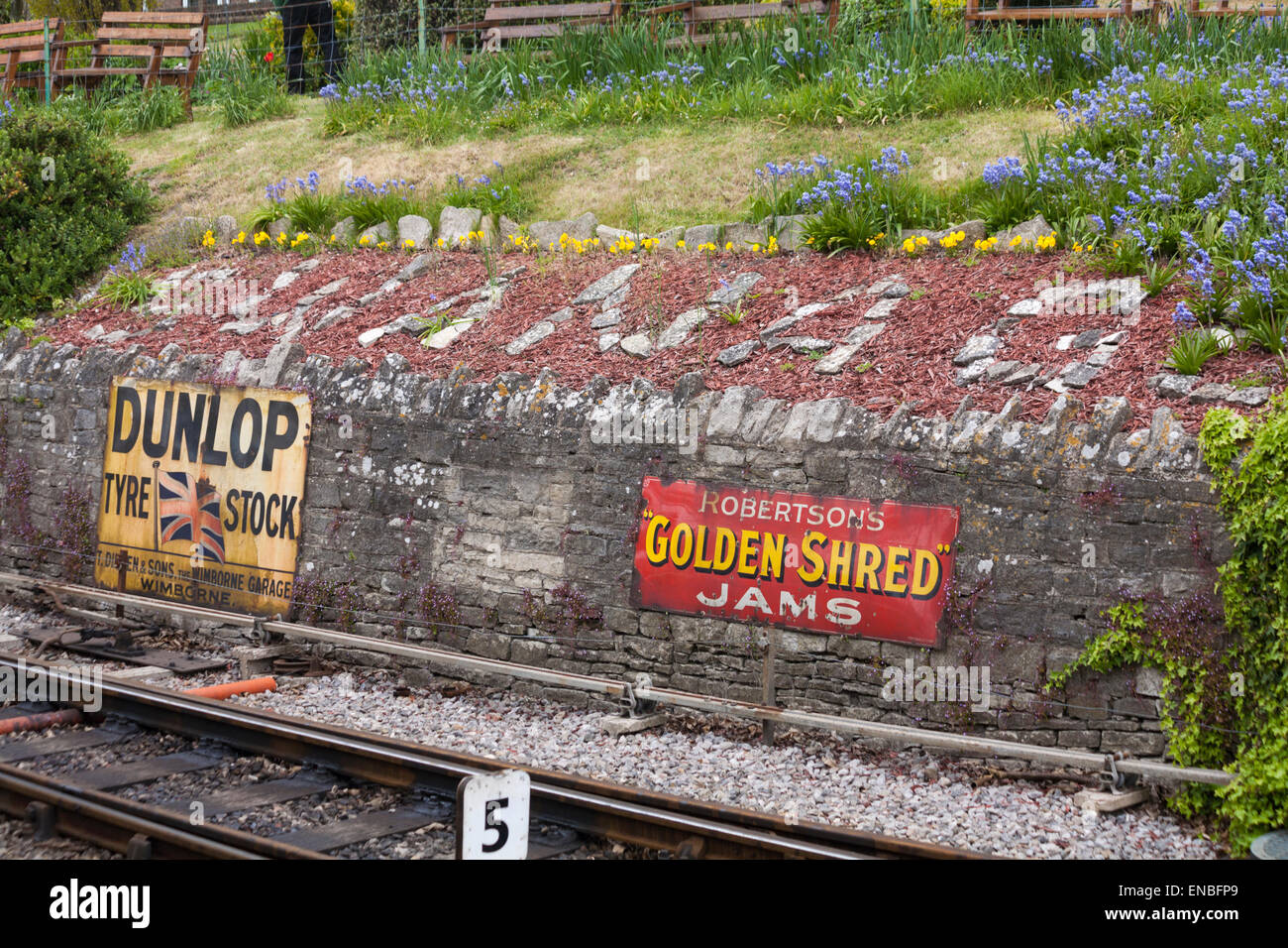 Swanage in stones with old signs on wall at Swanage Railway Station in ...
