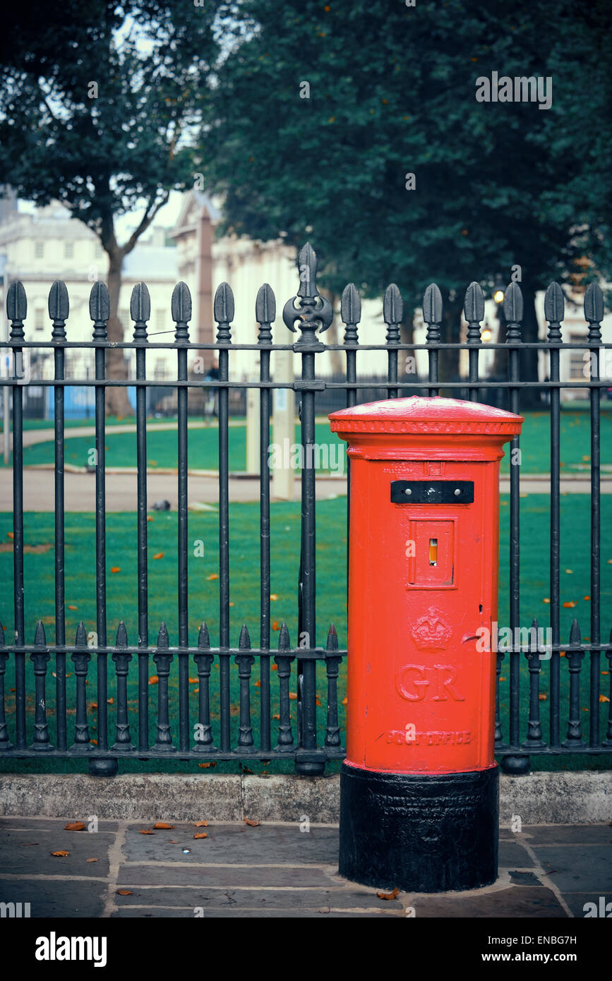 Red post box in street with historical architecture in London Stock ...