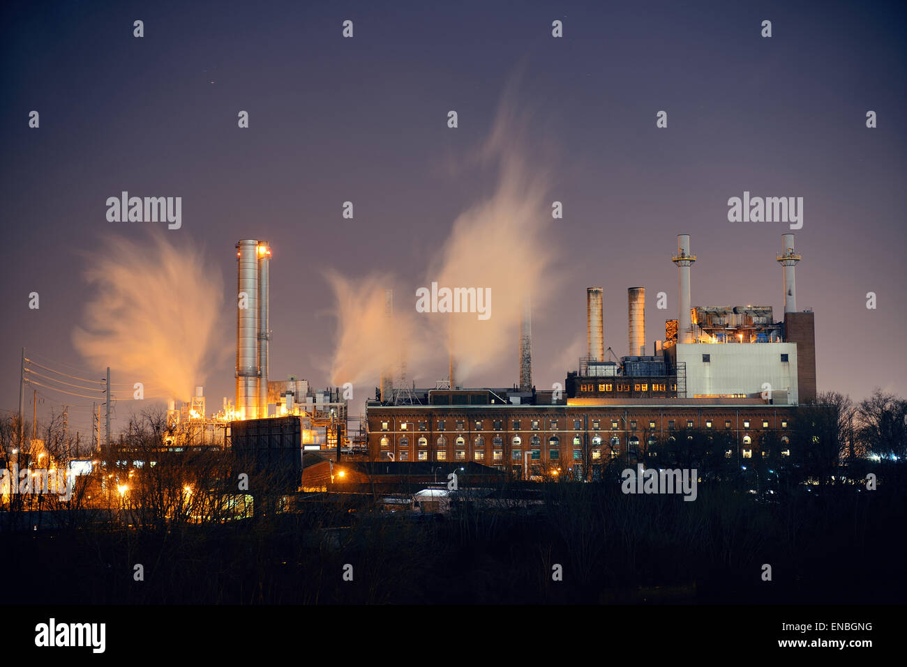 Factory with chimney at night in Philadelphia Stock Photo - Alamy