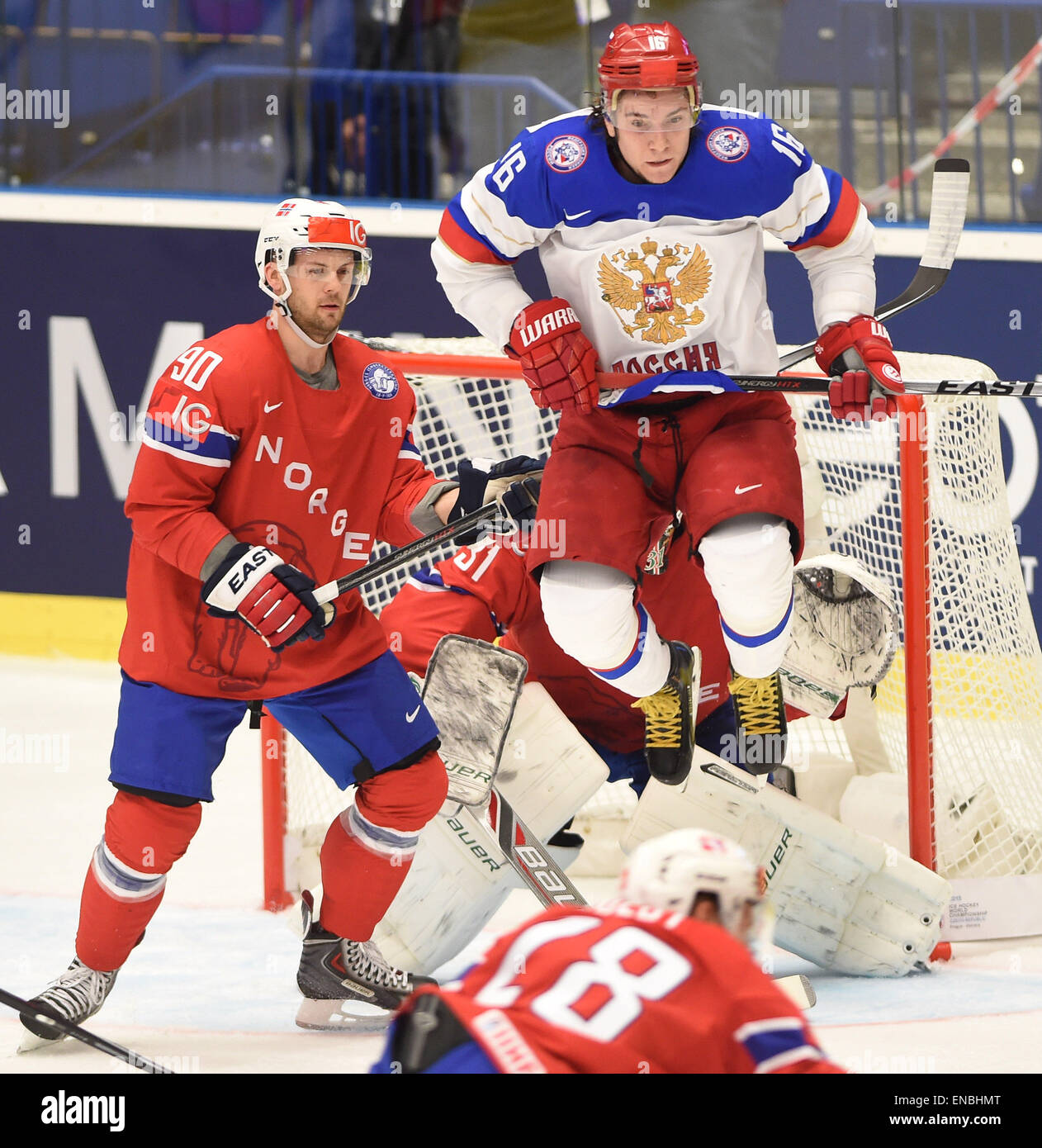 Daniel Sorvik of Norway, left, and Sergei Plotnikov of Russia in action during the Ice Hockey ...