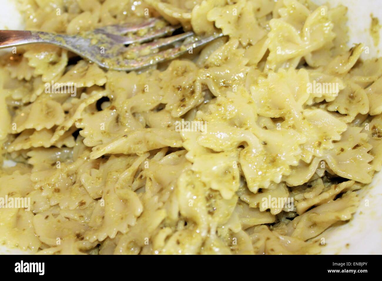 typical Italian pasta topped with basil sauce Stock Photo - Alamy
