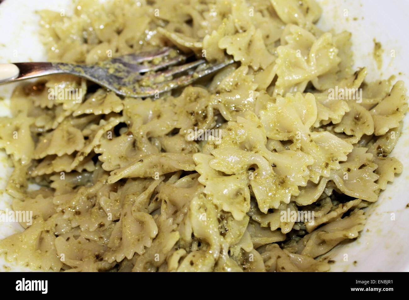 typical Italian pasta topped with basil sauce Stock Photo - Alamy