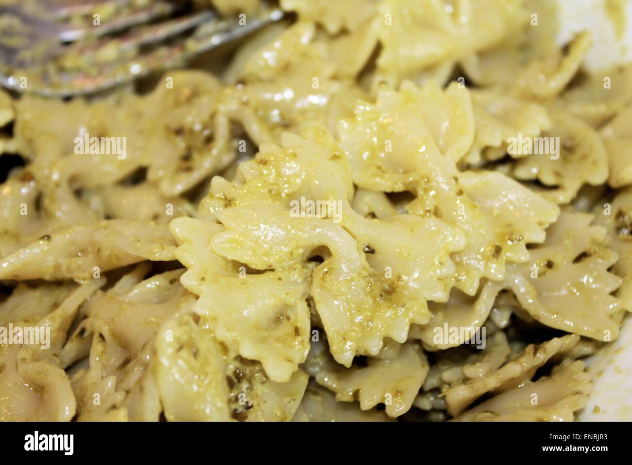 typical Italian pasta topped with basil sauce Stock Photo - Alamy