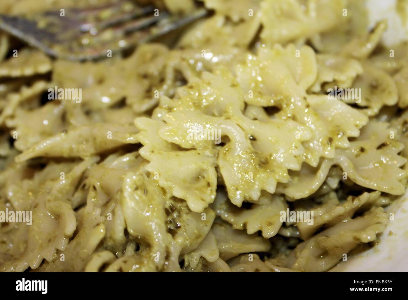 typical Italian pasta topped with basil sauce Stock Photo - Alamy