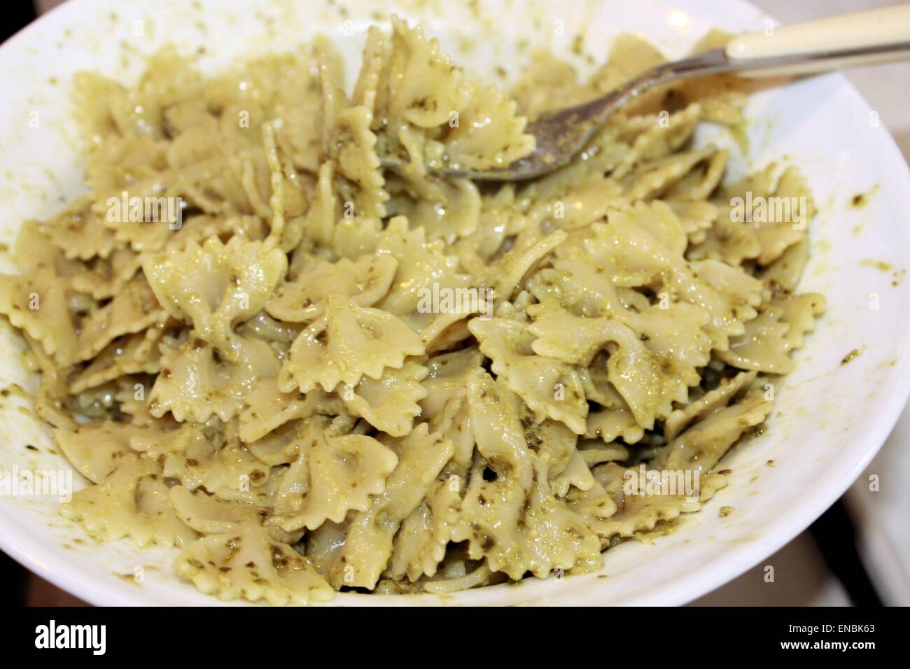 typical Italian pasta topped with basil sauce Stock Photo - Alamy