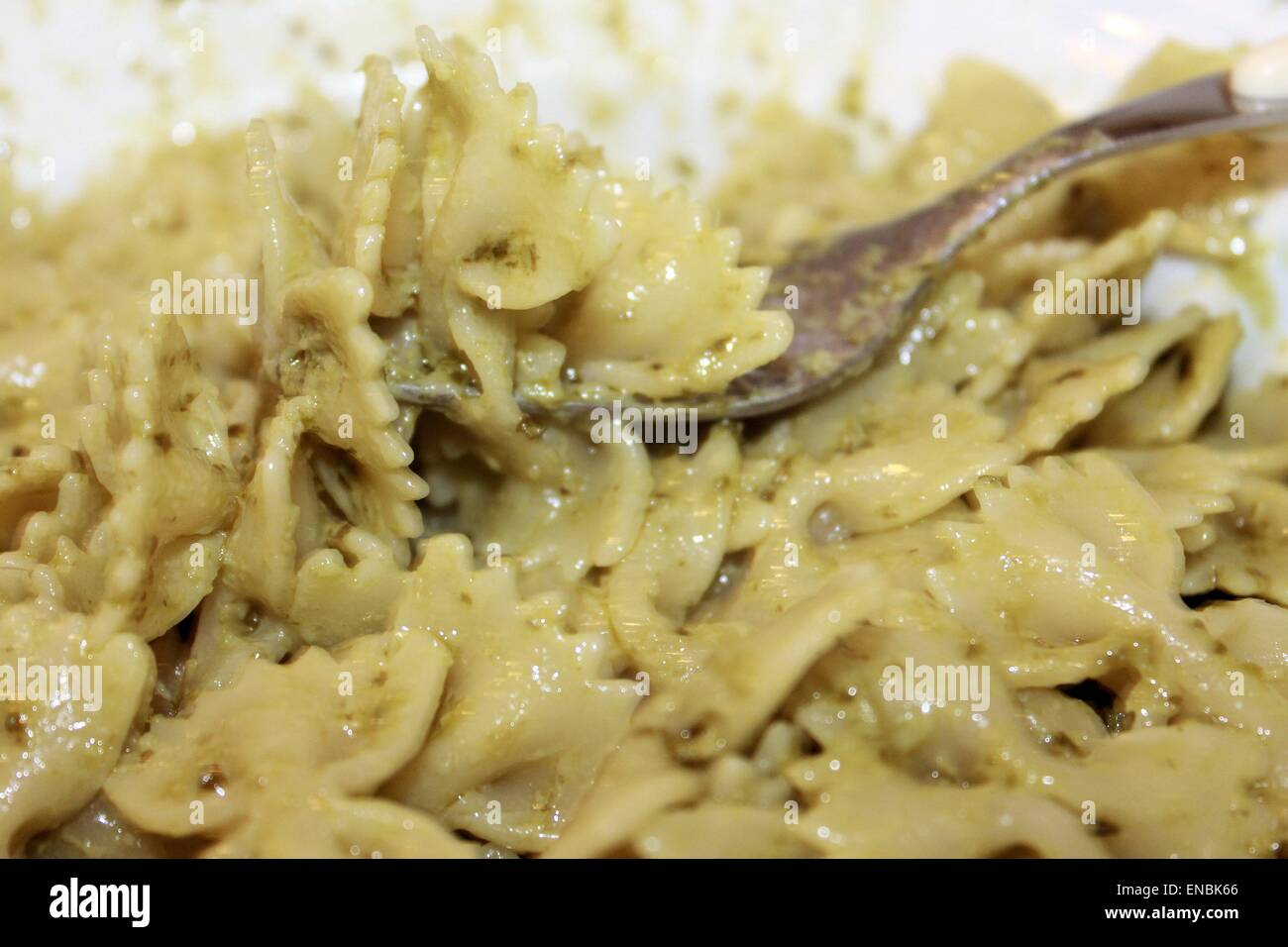 typical Italian pasta topped with basil sauce Stock Photo - Alamy