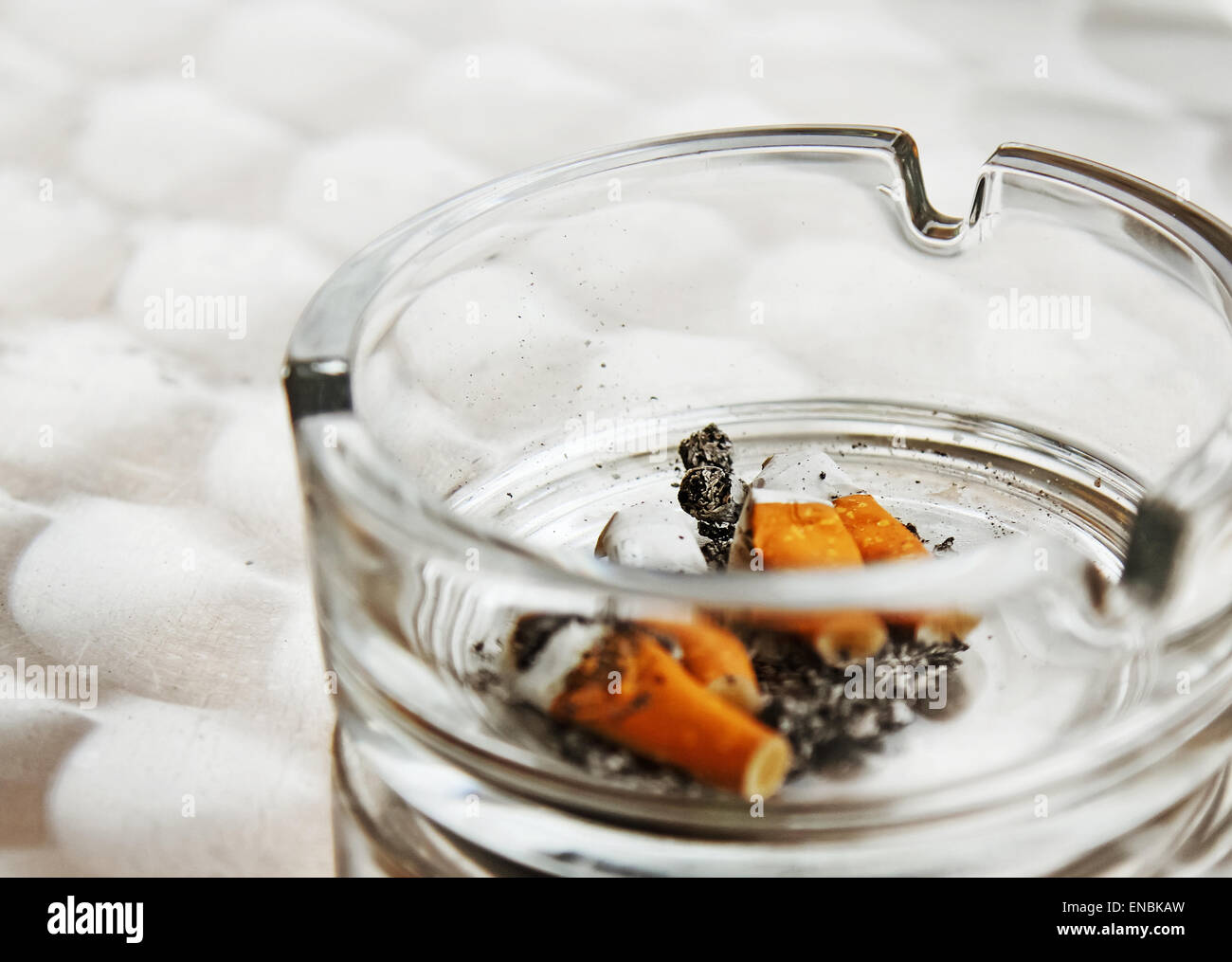 Cigarette butts in a glass ashtray, smoking in public places Stock ...