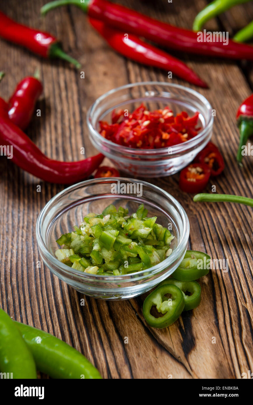 Mixed cutted Chilis (red and green) on vintage wooden background Stock ...