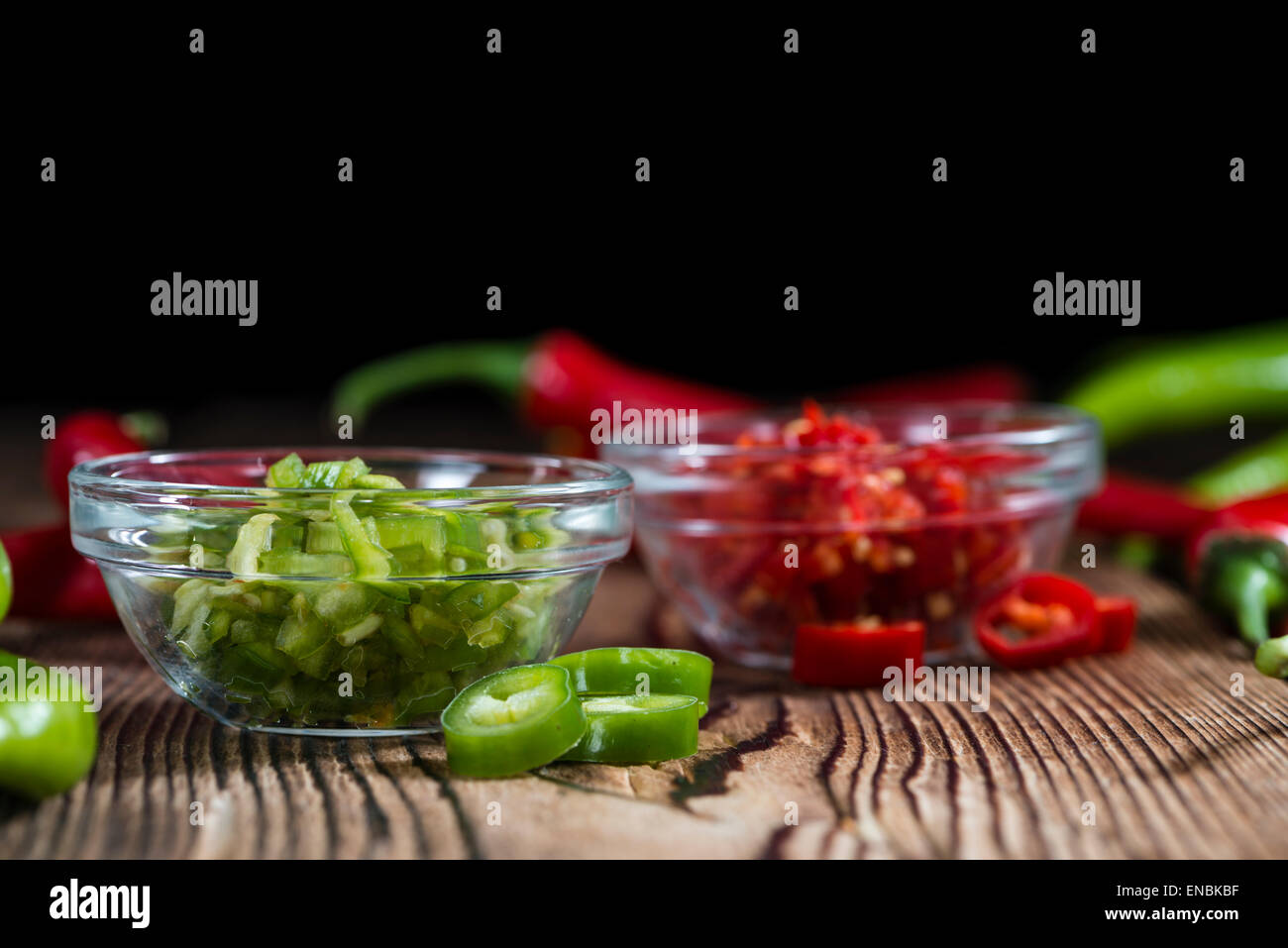 Mixed cutted Chilis (red and green) on vintage wooden background Stock ...
