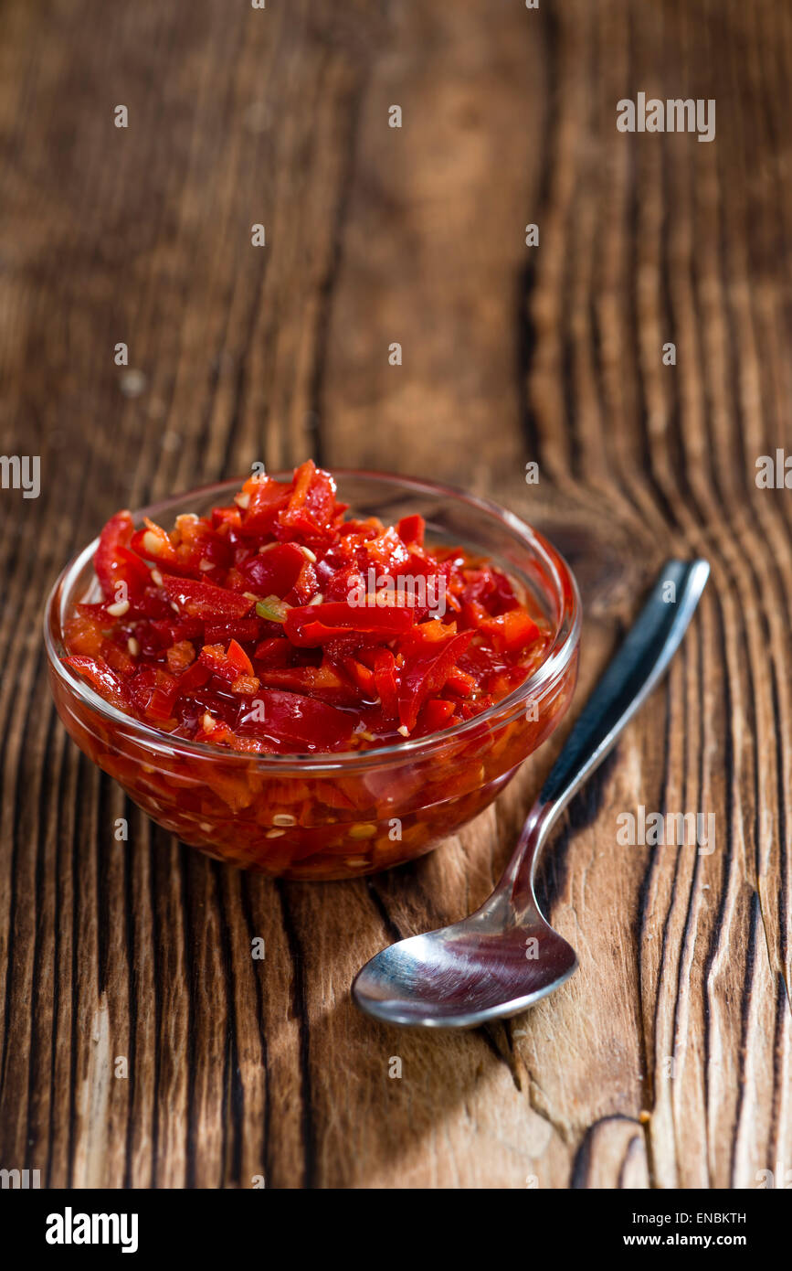 Small bowl with preserved red Chilis (on wooden background Stock Photo ...