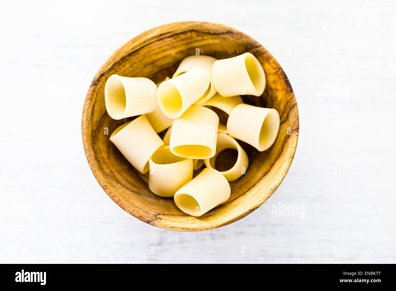 Organic dry pasta in small round bowl Stock Photo - Alamy
