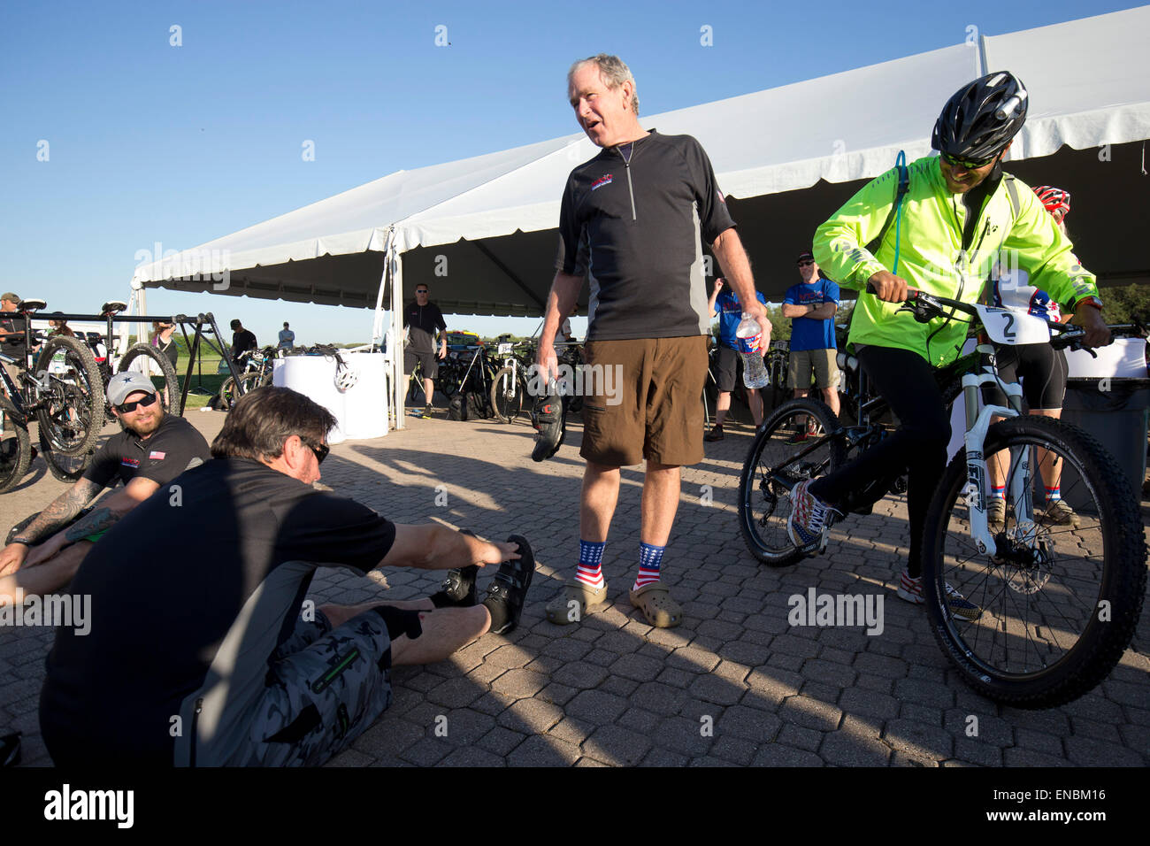 Former U.S. President George W. Bush shows off socks at the Bush ...