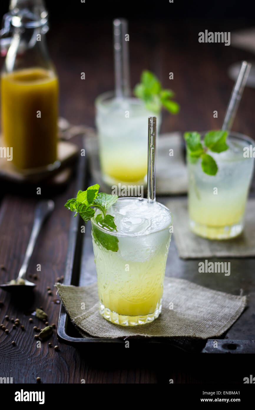 A Mumbai Mule cocktail in a glass on a wooden background Stock Photo ...