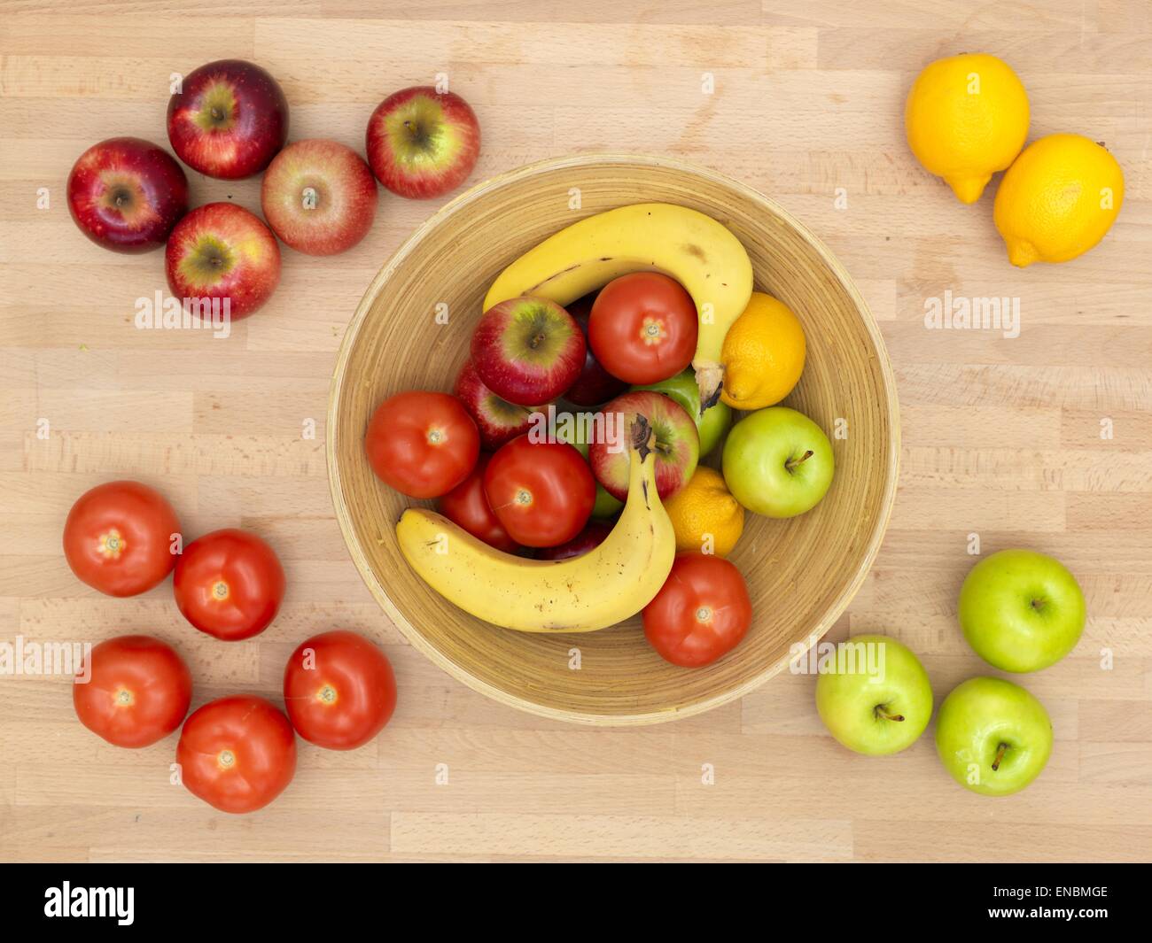 Assorted fruit placed on a wooden surface Stock Photo - Alamy