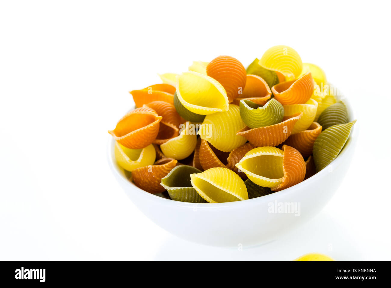 Multicolor shell pasta with tomato and spinach Stock Photo - Alamy
