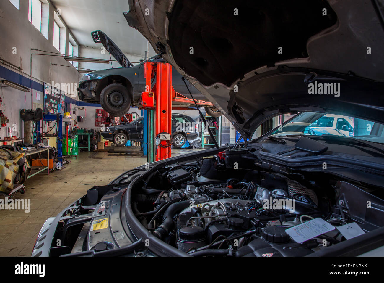 Old style car service with the cars inside Stock Photo - Alamy