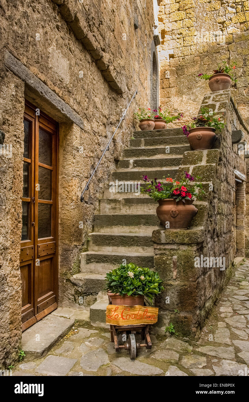 Ascending stone steps to dwelling in Civita di Bagnoregio, Italy Stock ...
