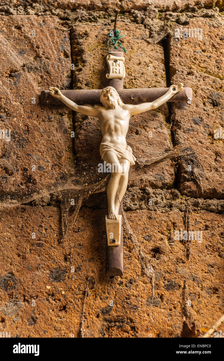 Crucifix on brick wall in Civita di Bagnoregio, Italy Stock Photo - Alamy
