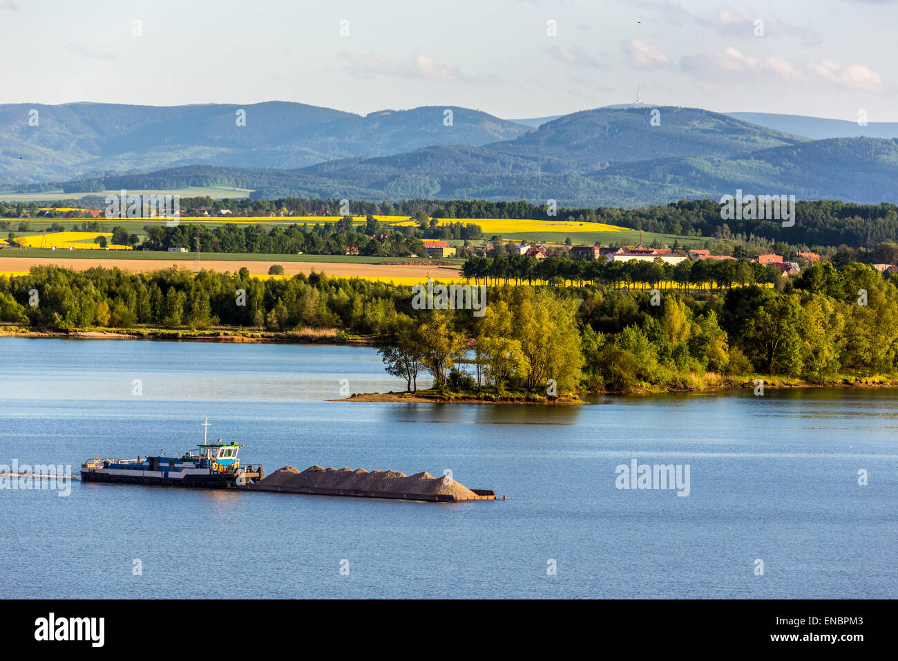 The barge with the sand on the lake Stock Photo - Alamy