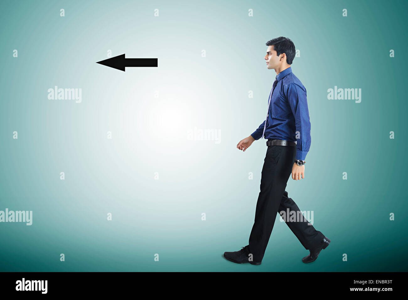1 indian Business Man Arrow Walking Stock Photo - Alamy