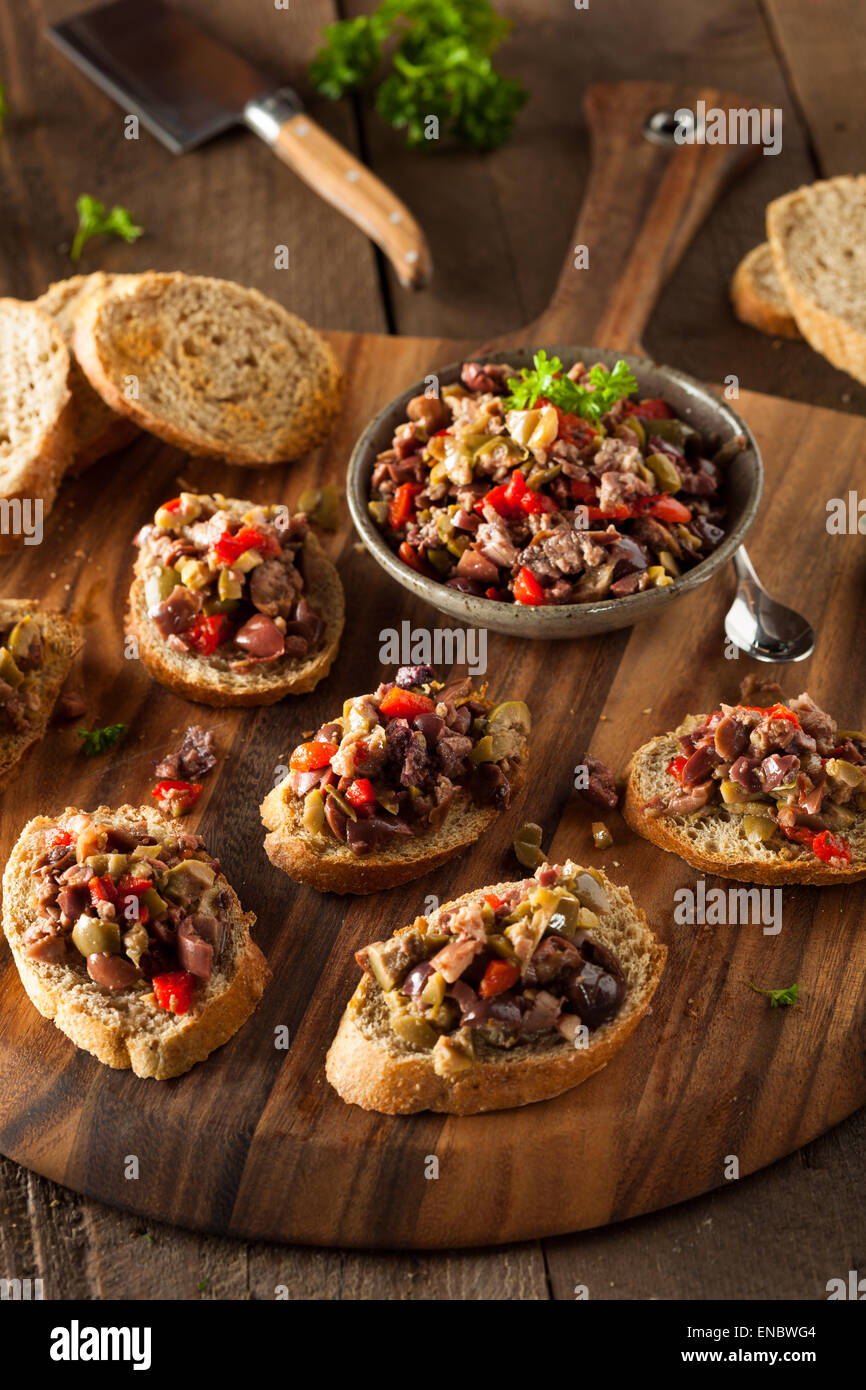 Homemade Mixed Olive Tapenade on Whole Wheat Crostini Stock Photo - Alamy