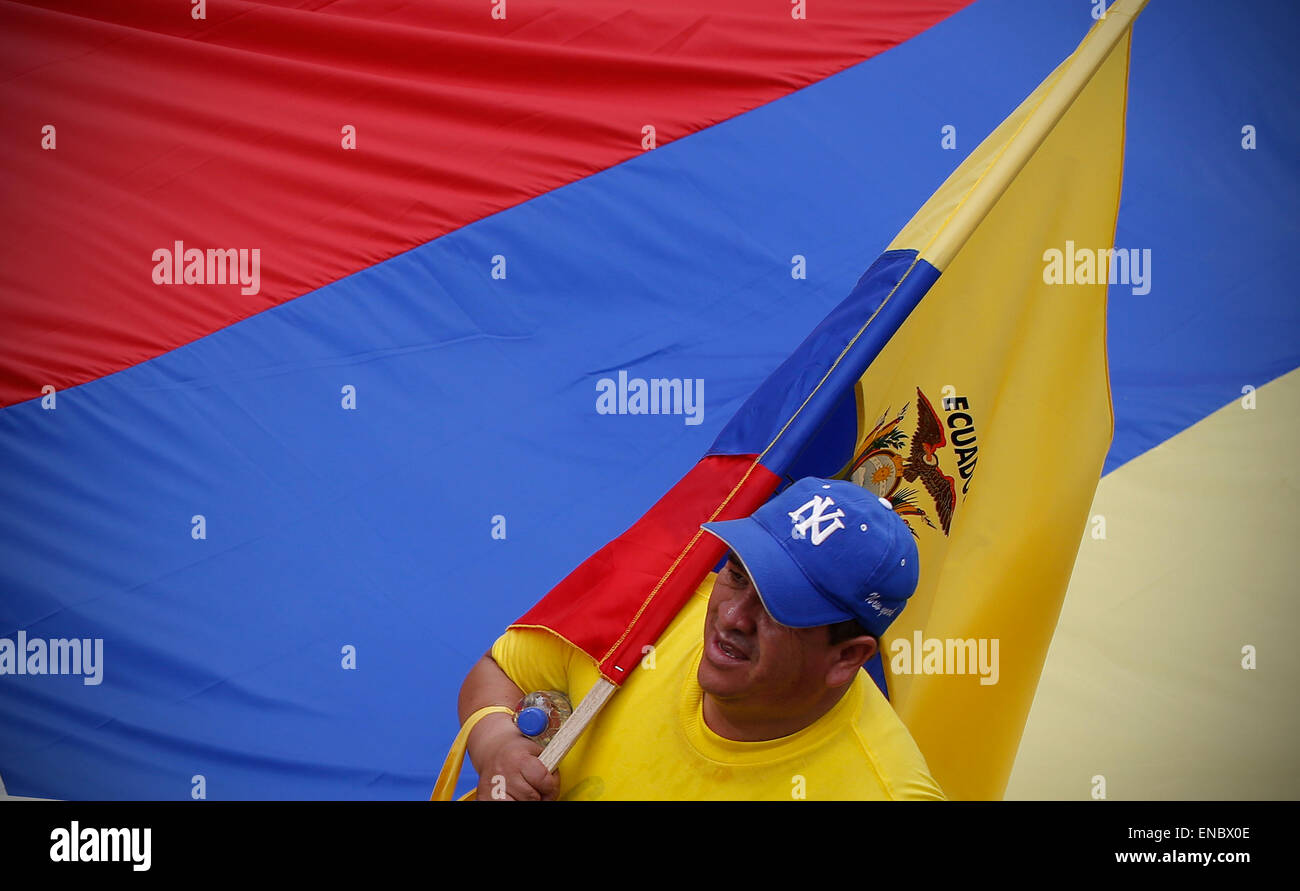 Quito, Ecuador. 1st May, 2015. A man takes part in a march in ...