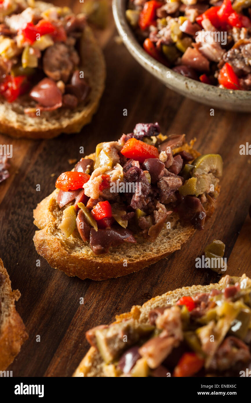 Homemade Mixed Olive Tapenade on Whole Wheat Crostini Stock Photo - Alamy