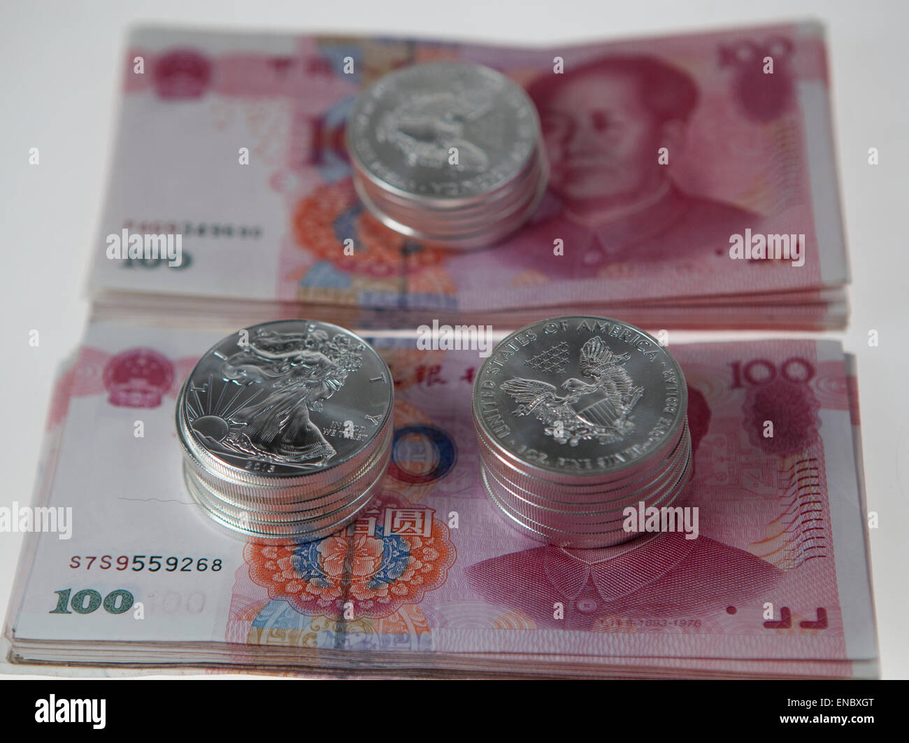 Yuan RMB Chinese Currency with Silver Bullion Stock Photo - Alamy