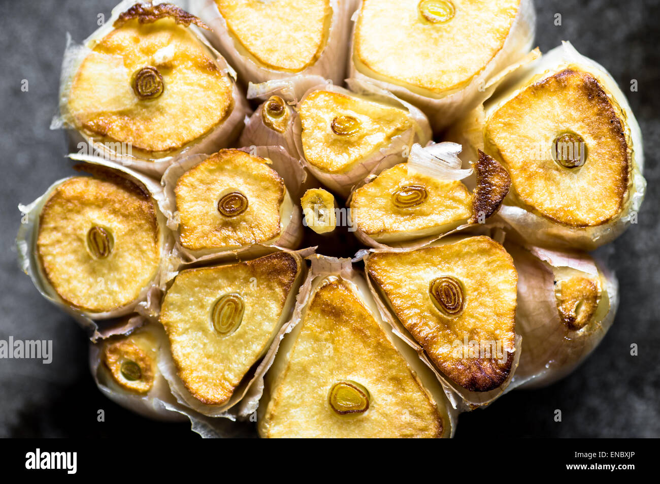 Cut head of garlic grill close-up view from above Stock Photo - Alamy