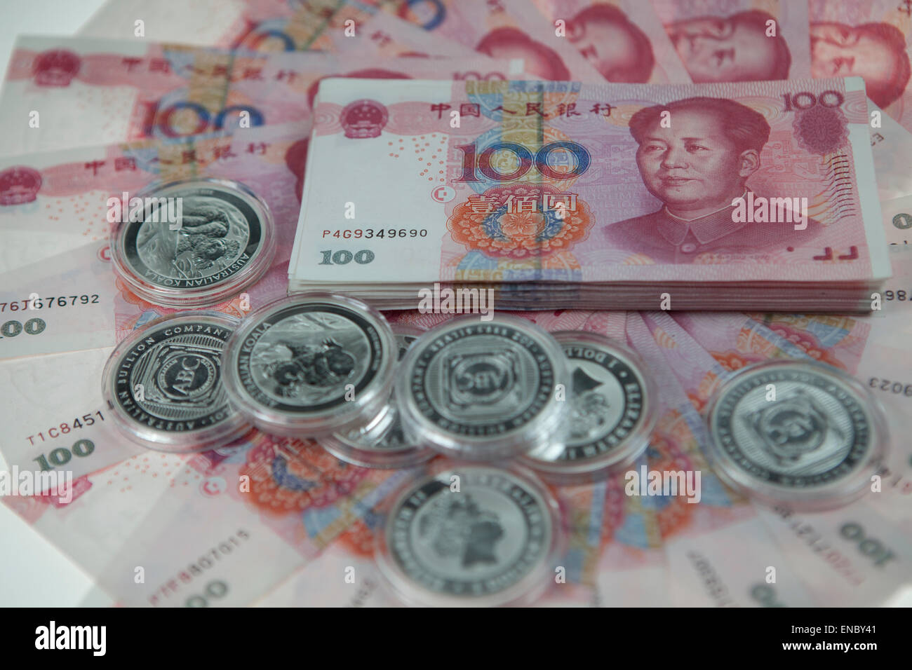 Yuan RMB Chinese Currency with Silver Bullion Stock Photo - Alamy