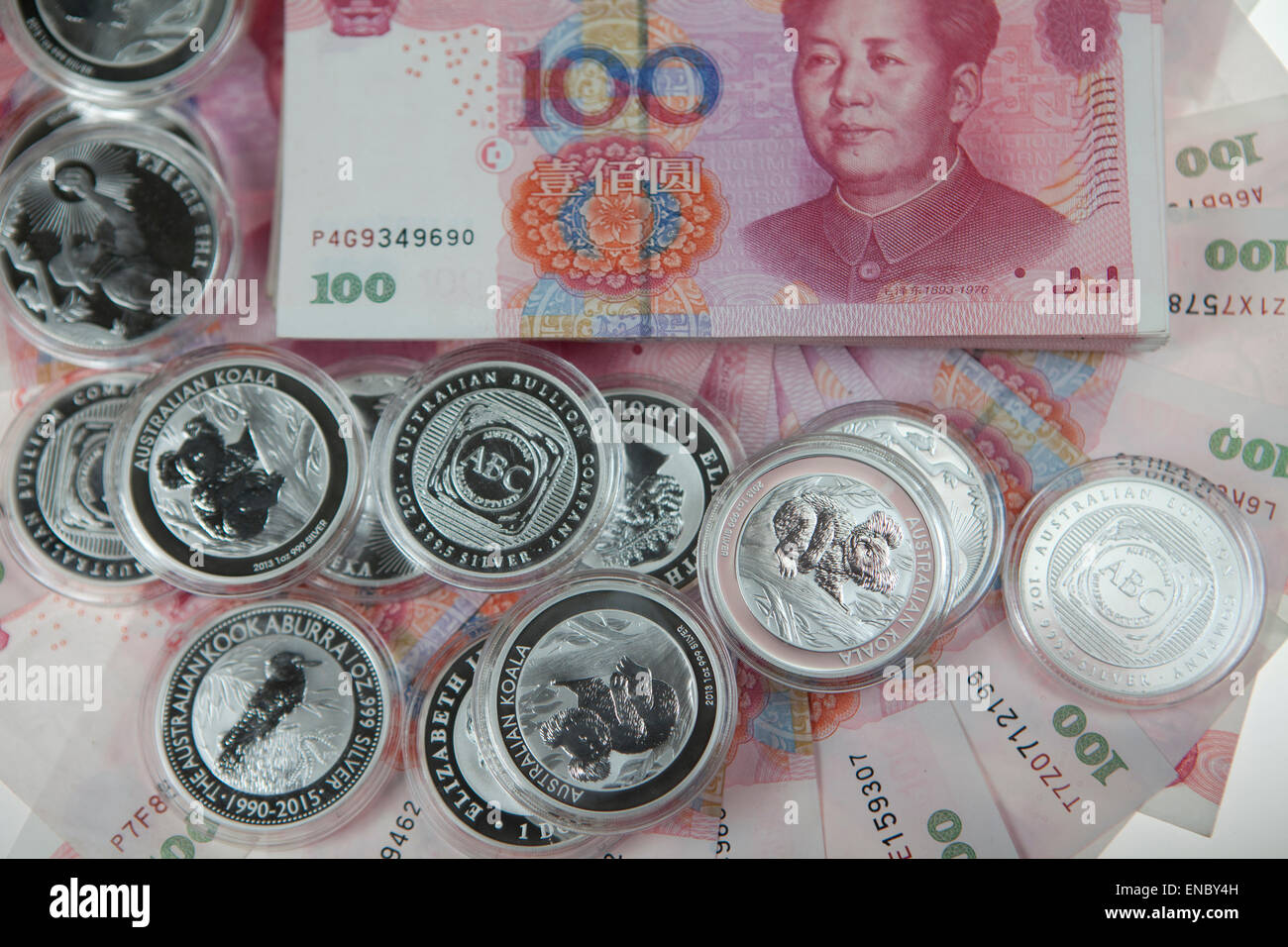 Yuan RMB Chinese Currency with Silver Bullion Stock Photo - Alamy