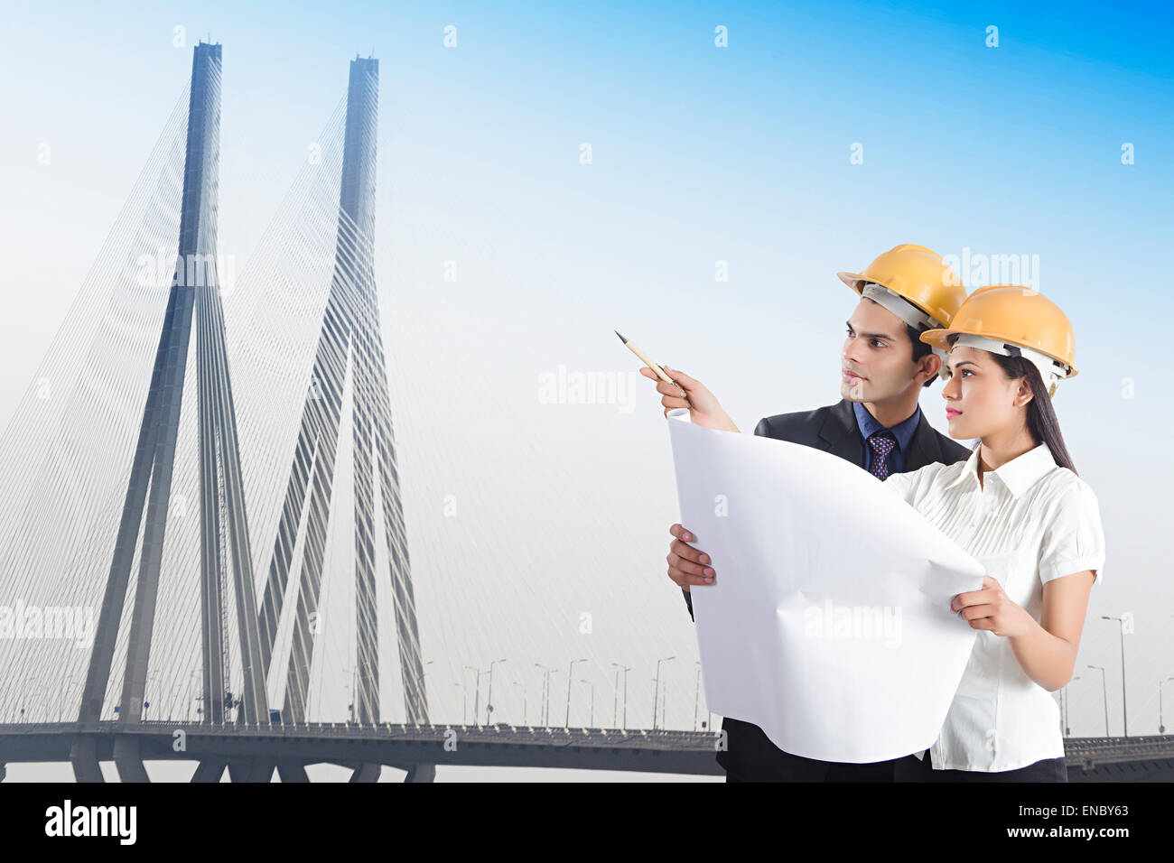 2 indian Engineer Colleague Bridge site Planning map Checking Stock ...