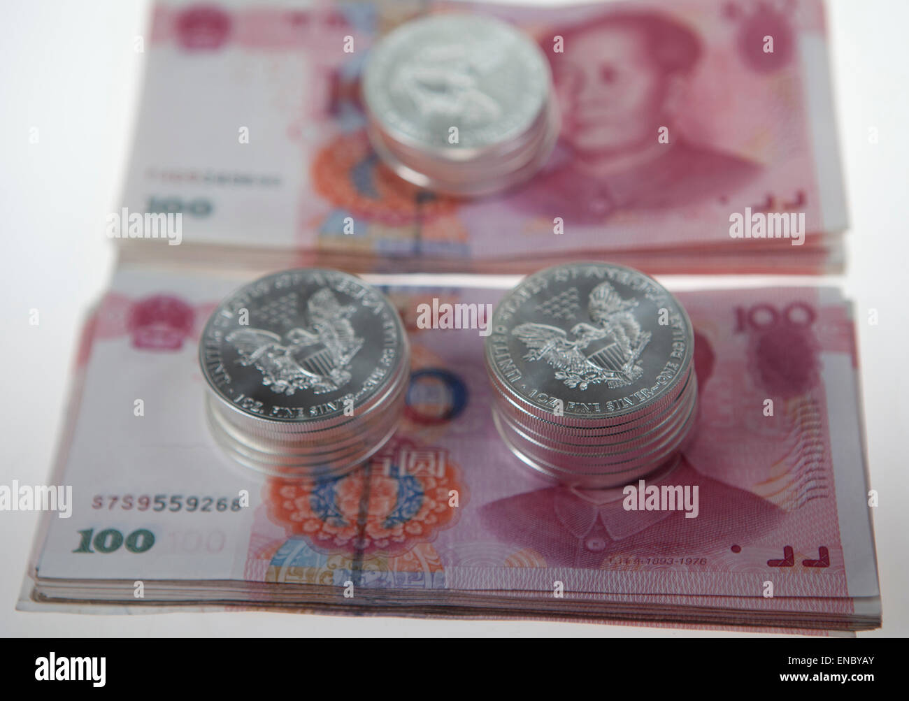 Yuan RMB Chinese Currency with Silver Bullion Stock Photo - Alamy