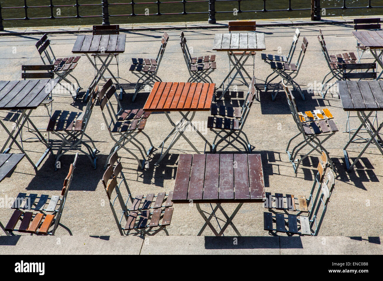Empty tables of a beer garden beside the River Spree, Berlin, Germany ...