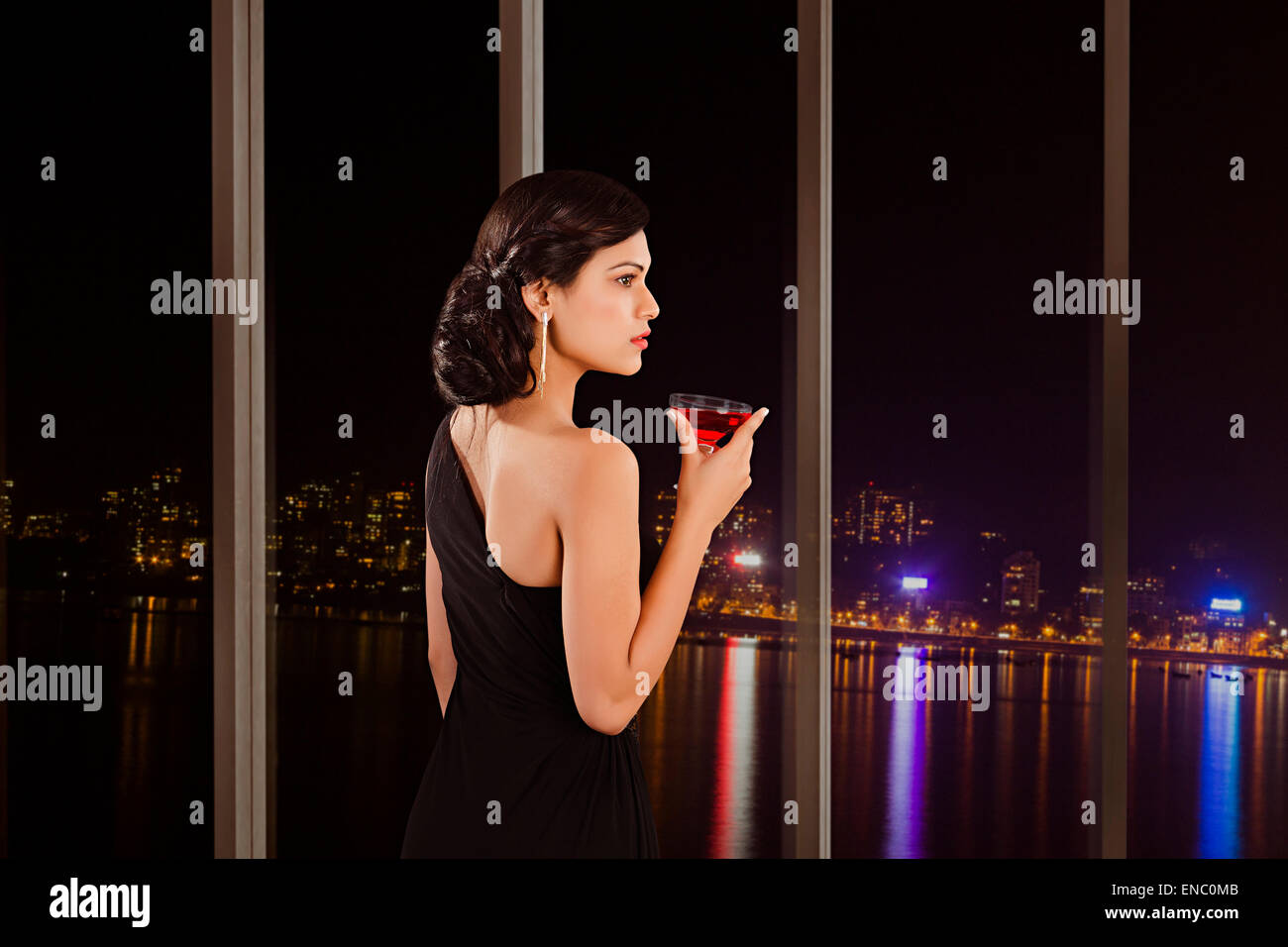 1 Beautiful Woman at home Drinking Alcohol Stock Photo - Alamy