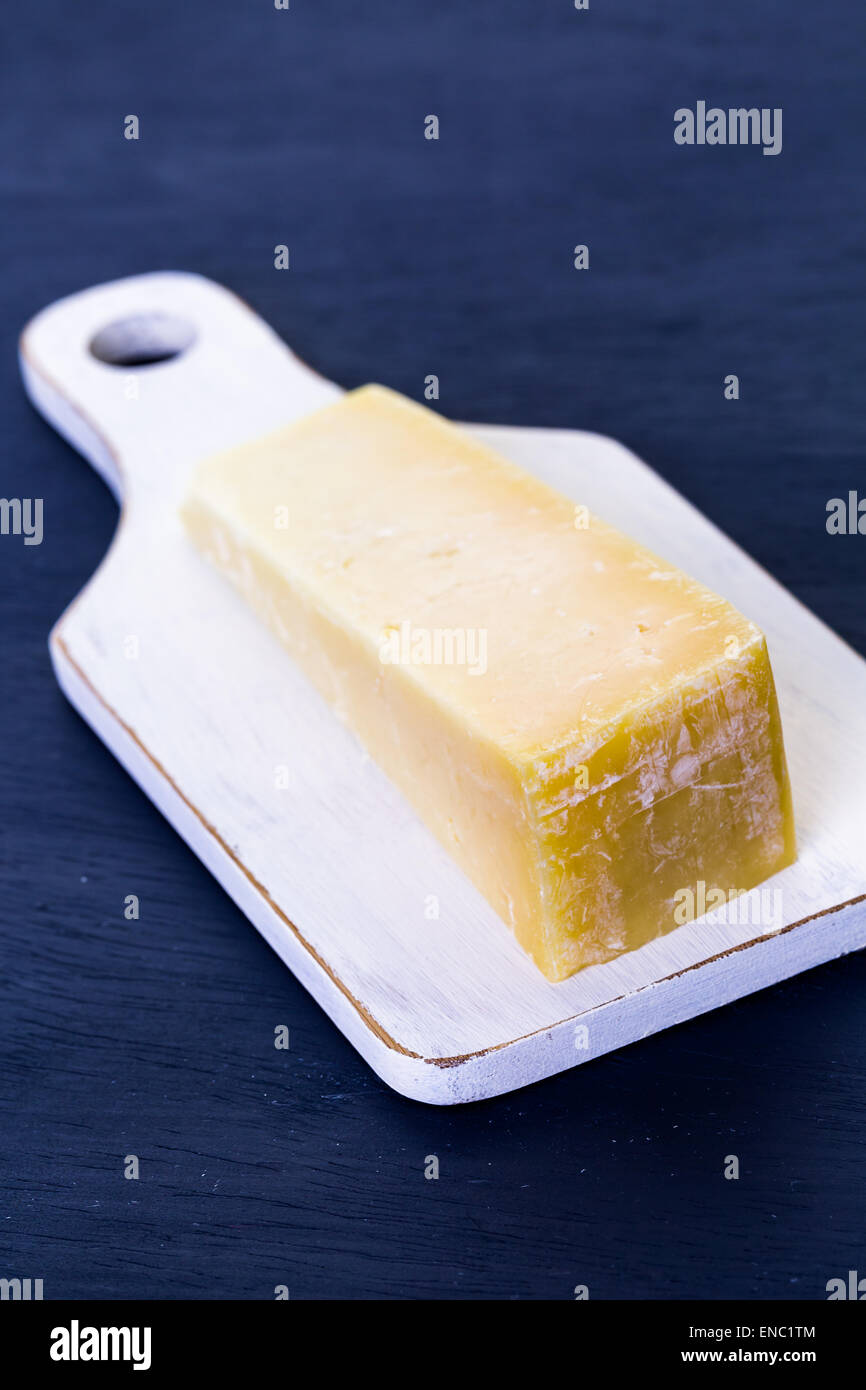 Slice of parmesan cheese on the board Stock Photo - Alamy