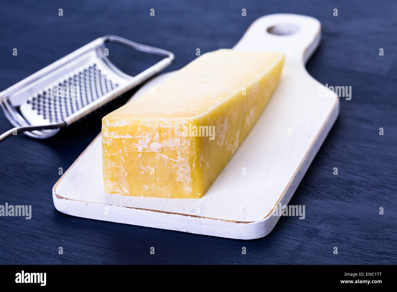 Slice of parmesan cheese on the board Stock Photo - Alamy