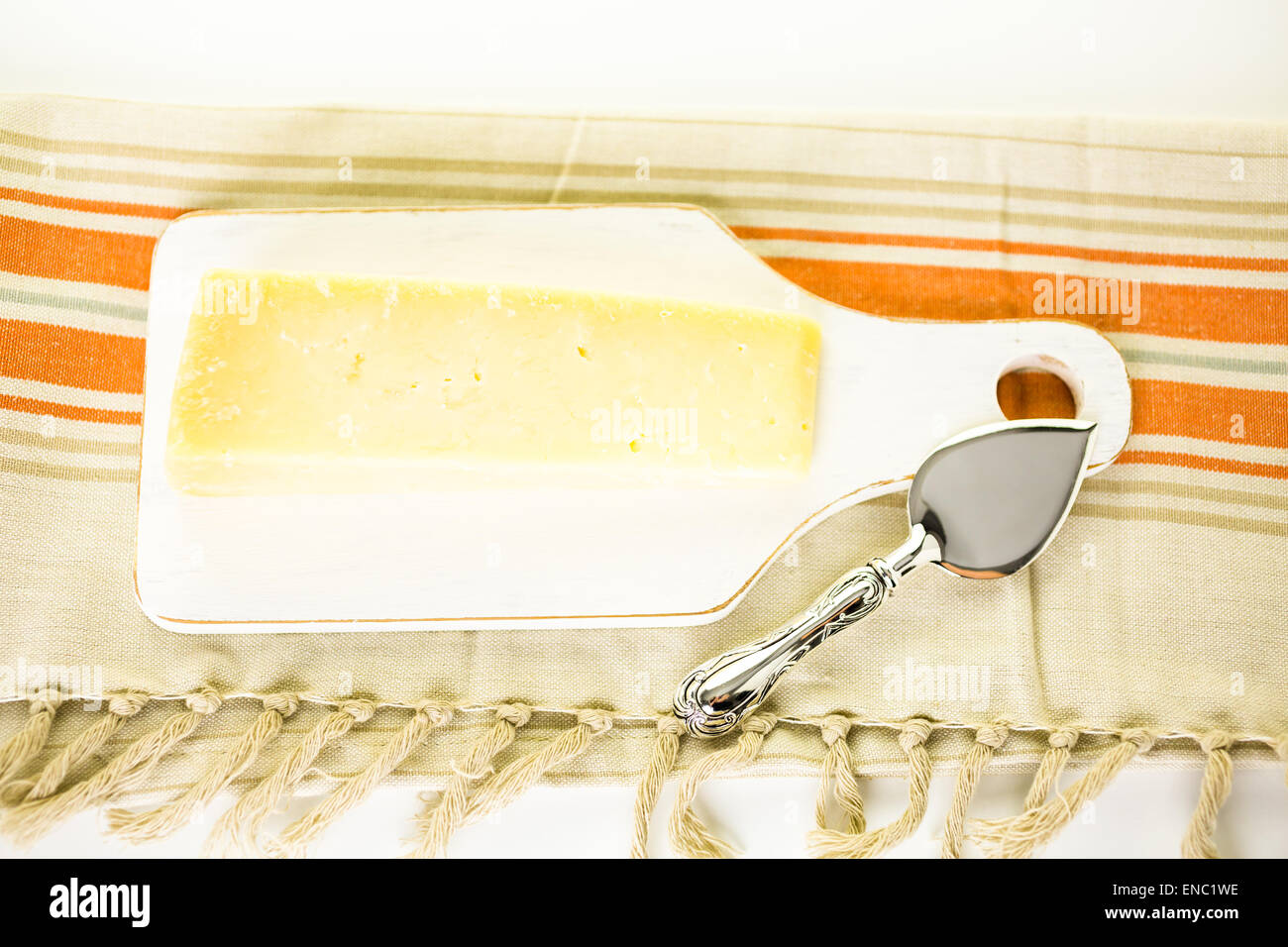 Slice of parmesan cheese on the board Stock Photo - Alamy