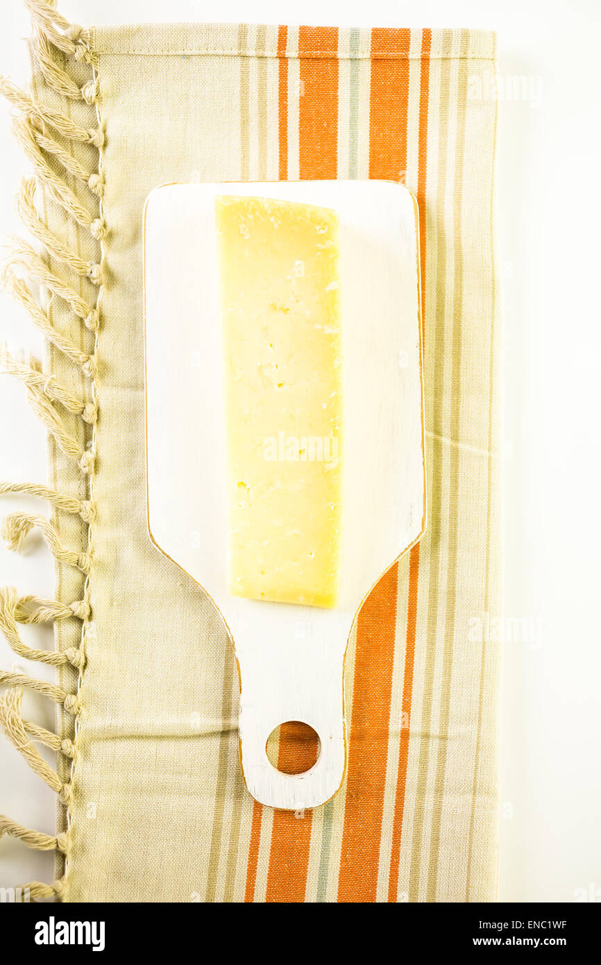 Slice of parmesan cheese on the board Stock Photo - Alamy
