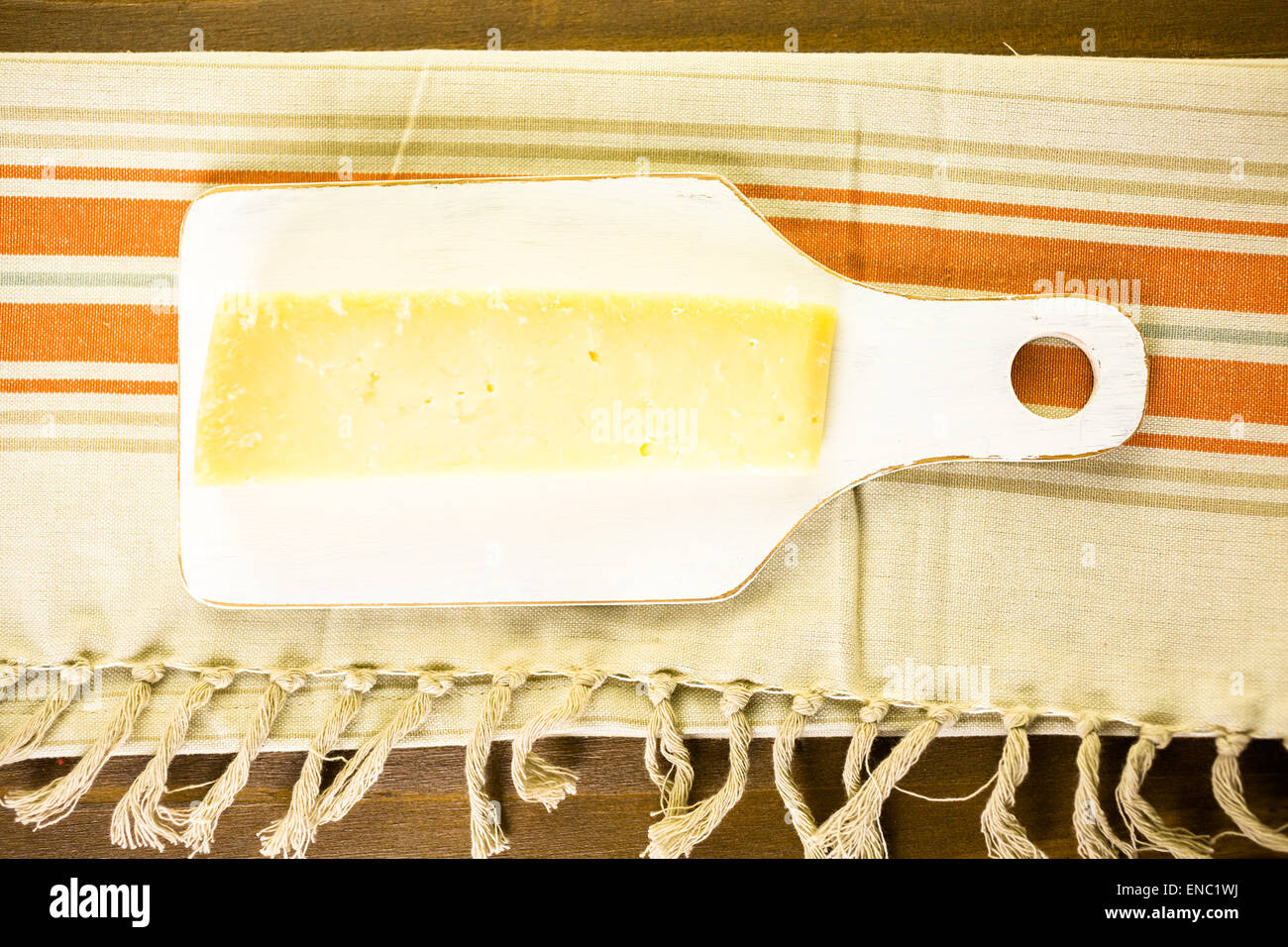 Slice of parmesan cheese on the board Stock Photo - Alamy