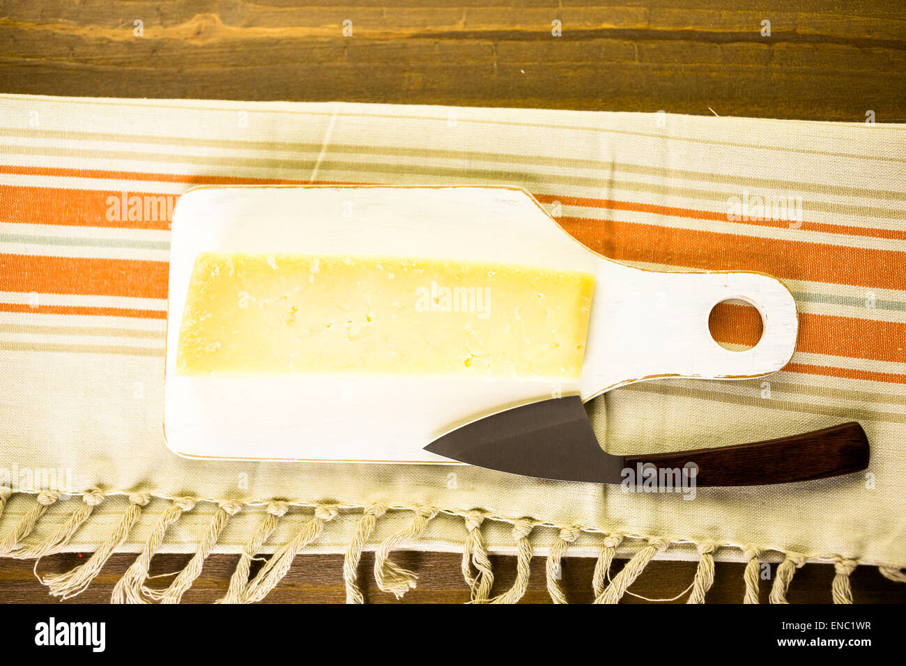 Slice of parmesan cheese on the board Stock Photo - Alamy