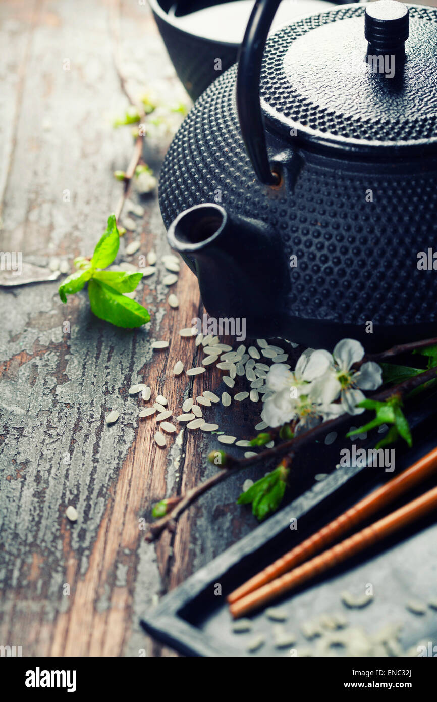 Chinese Tea Set,chopsticks and sakura branch on rustic wooden table ...
