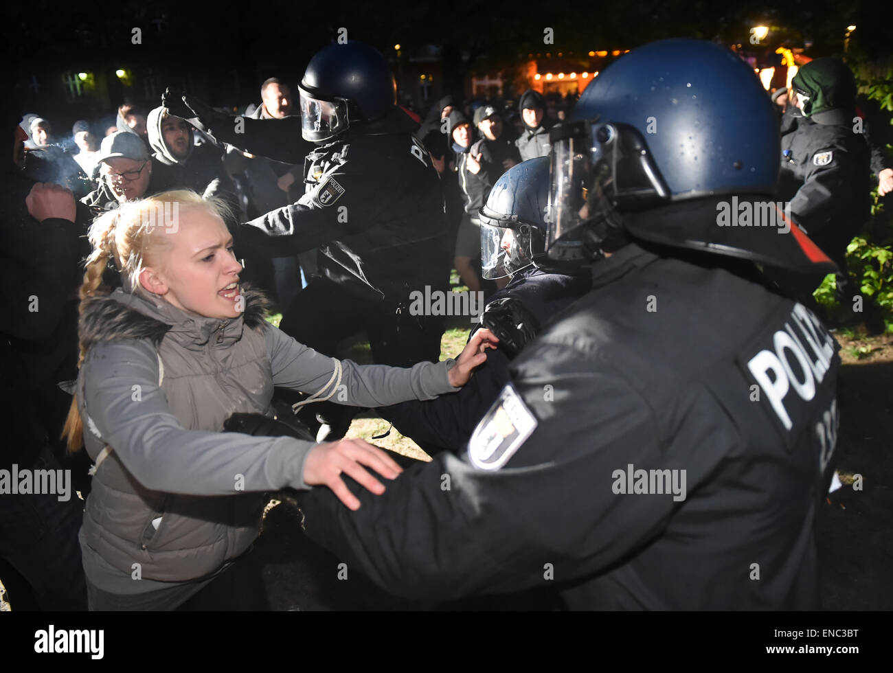 Demonstrators and riot police scuffle with eath other during the ...