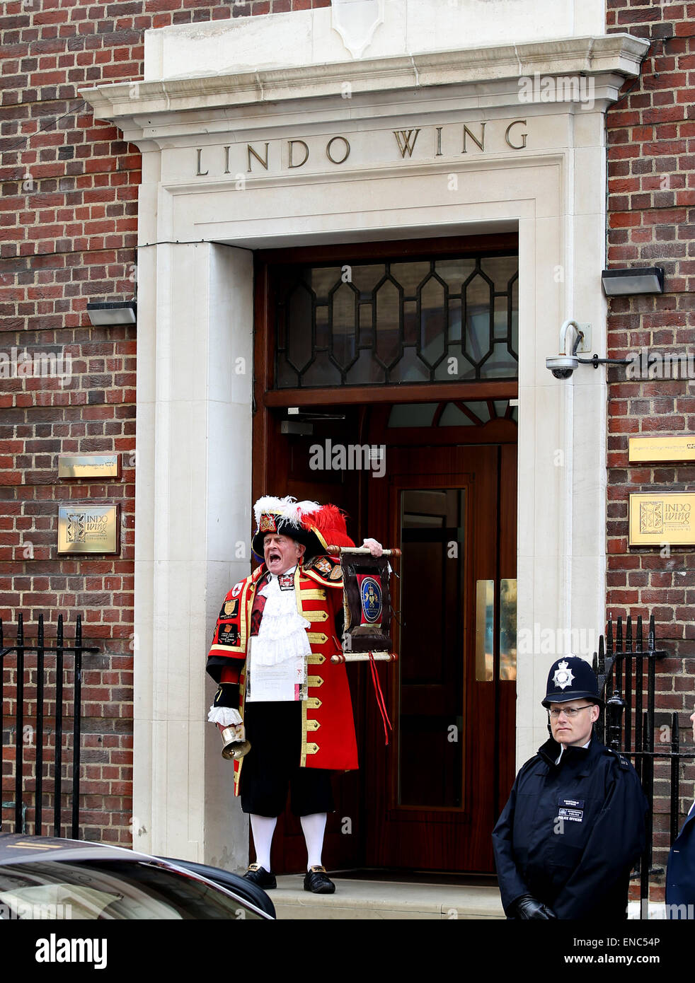 London, UK. 2nd May, 2015. A town crier announces the birth of the ...