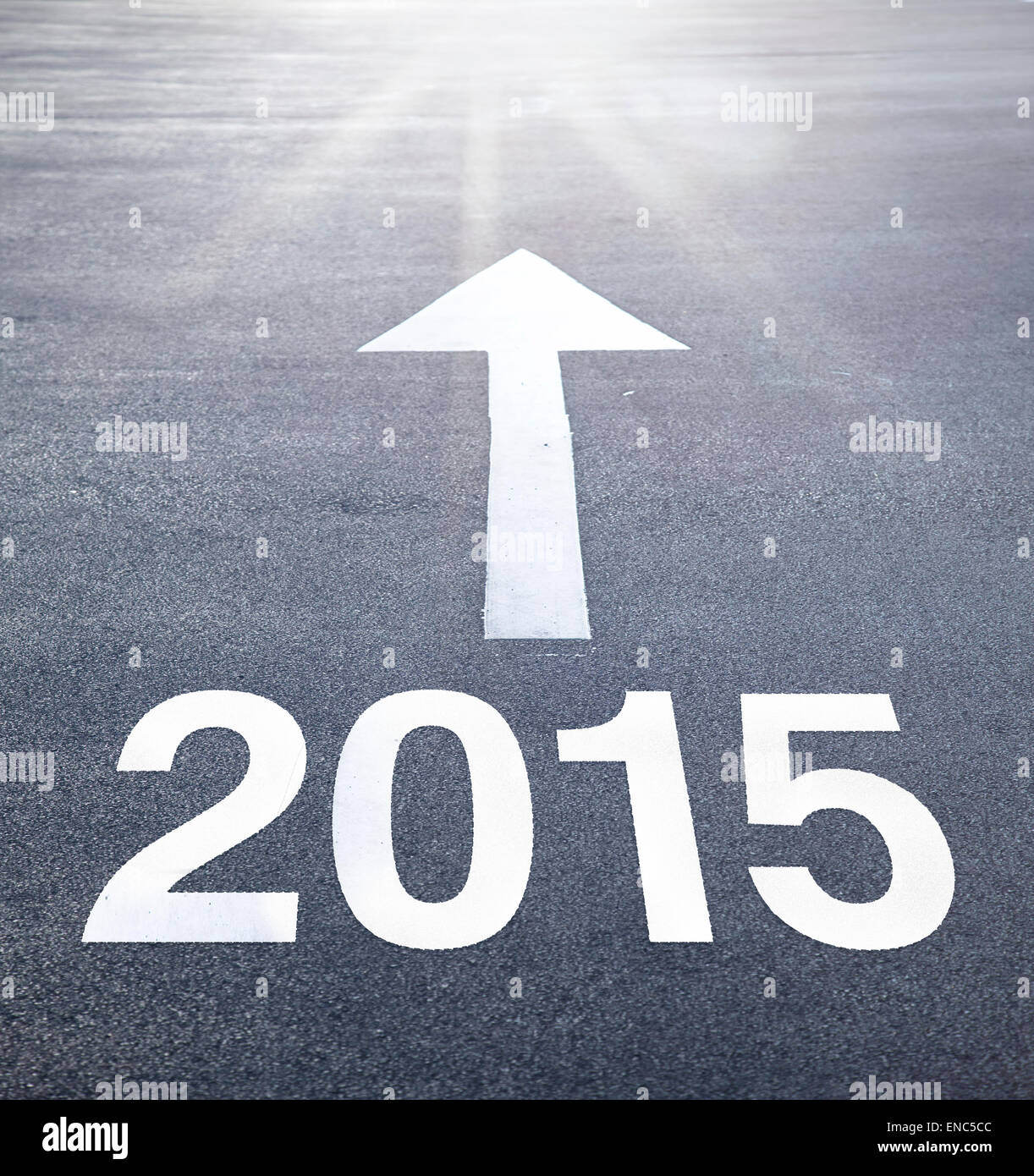 Number 2015 on road and sun beam Stock Photo - Alamy
