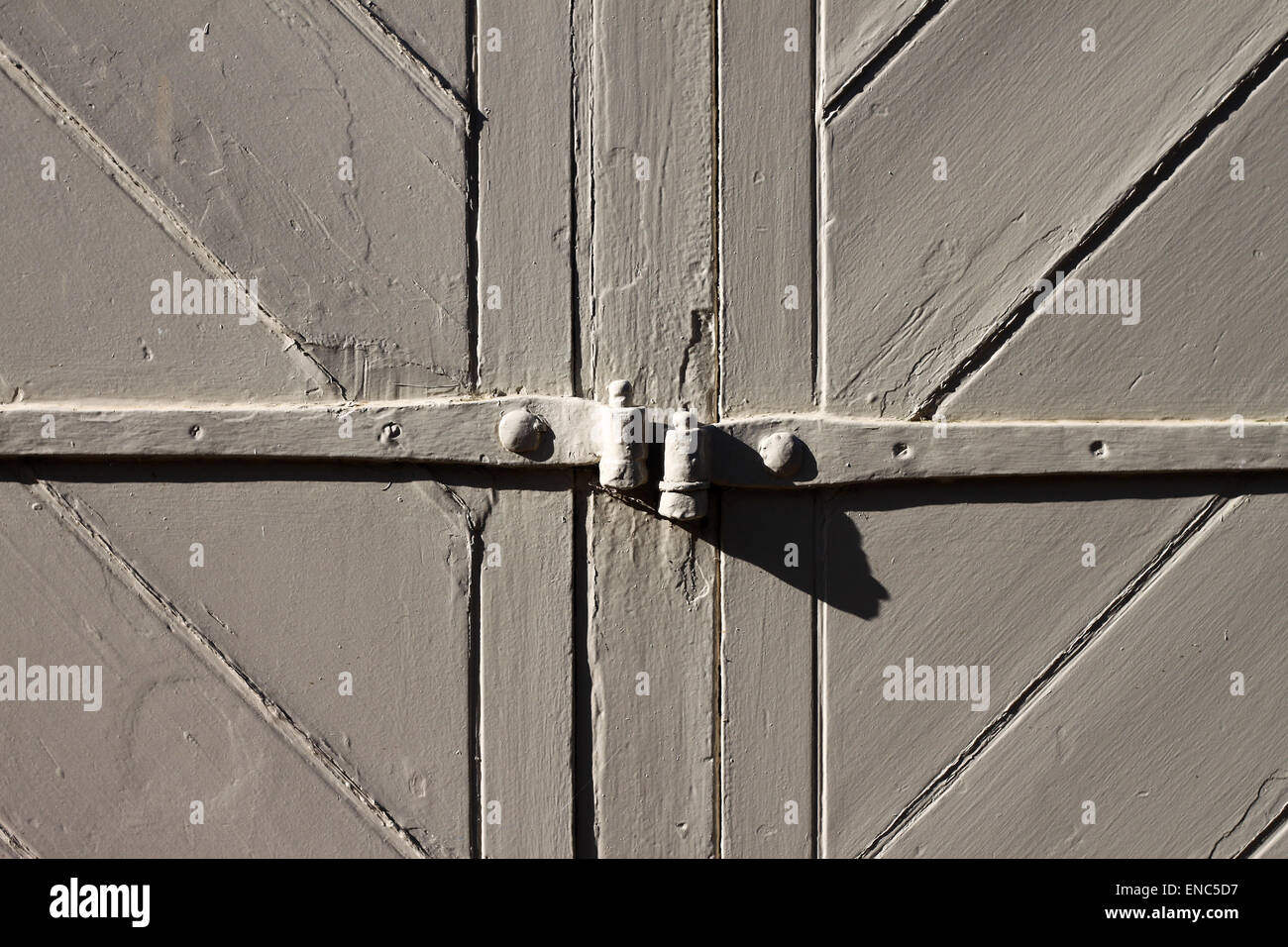 Detail of old white wooden door with hinges on outhouse in Suffolk ...