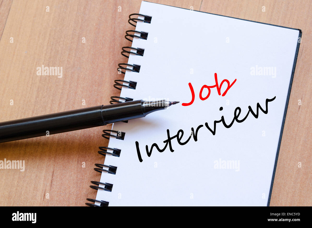 White notepad and ink pen on the wooden desk job interview concept ...