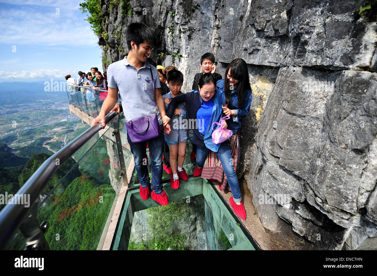 Zhangjiajie, China's Hunan Province. 2nd May, 2015. Tourists walk on a ...